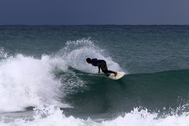 Surfing - Riding a Wave on Light Boards. Editorial Photo - Image of ...