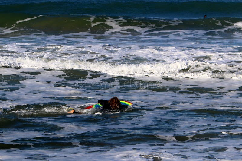 Surfing - riding the waves editorial photo. Image of splashing - 135033086