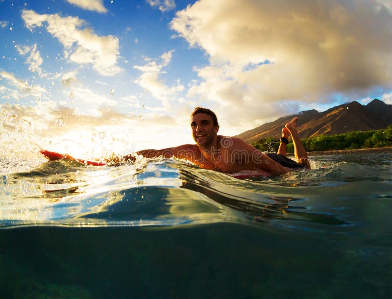 Surfing at Sunset stock photo. Image of extreme, hawaiian - 57507992