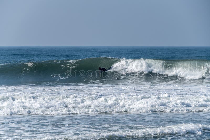 Surfing the waves stock photo. Image of surf, beach - 234830884