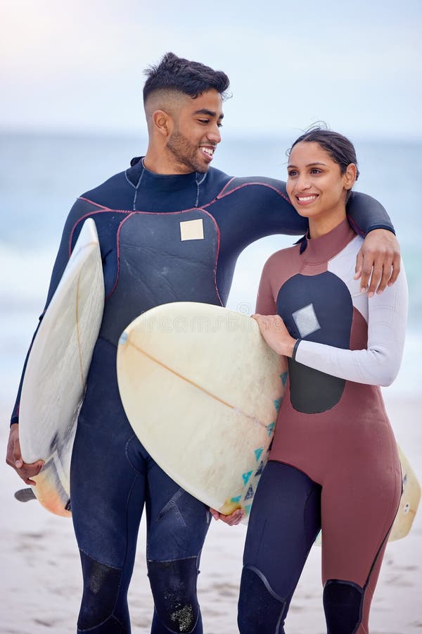 Surfs Up Babe. a Young Couple Surfing Together at the Beach. Stock ...