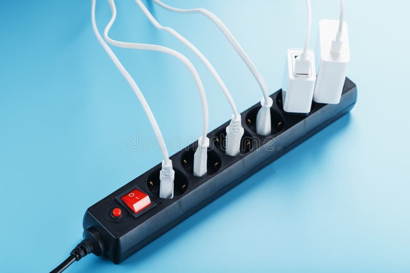 Electric Mains Filter with Inserted White Plugs of Electrical ...