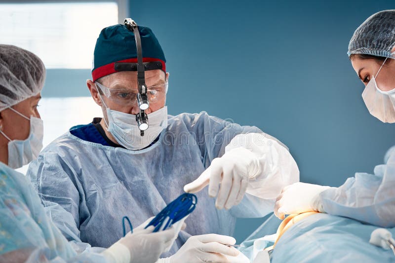 Surgeon Assistant Feeds Coagulator, Plastic Surgery, Professional ...