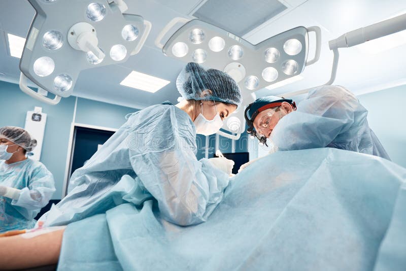 Surgeon Assistant Feeds Coagulator, Plastic Surgery, Professional ...