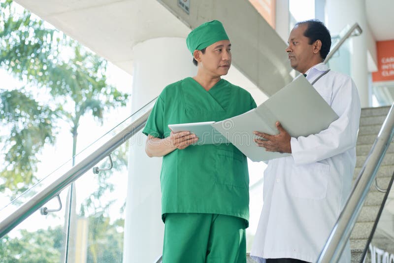 Surgeon and Chief Physician Talking Stock Image - Image of males ...