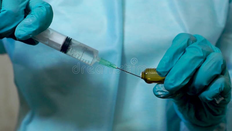 Surgeon Draws a Solution from an Ampoule into a Syringe Stock Video ...