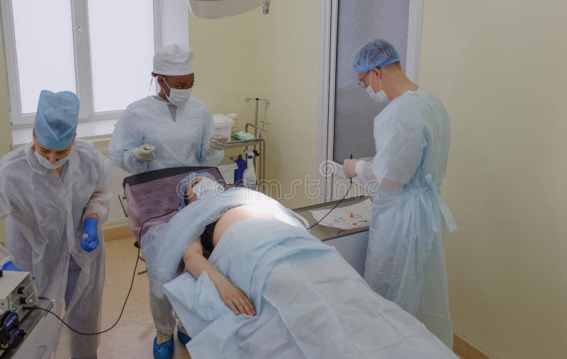 The Surgeon and His Assistant are Preparing for the Operation of a ...