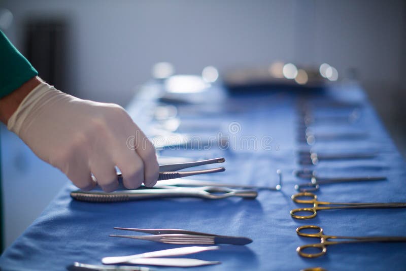 Surgeon Holding Surgical Tool in Operation Theater Stock Photo - Image ...