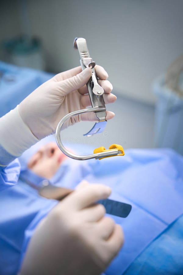 Surgeon Holds a Special Instrument in His Hand Stock Photo - Image of ...