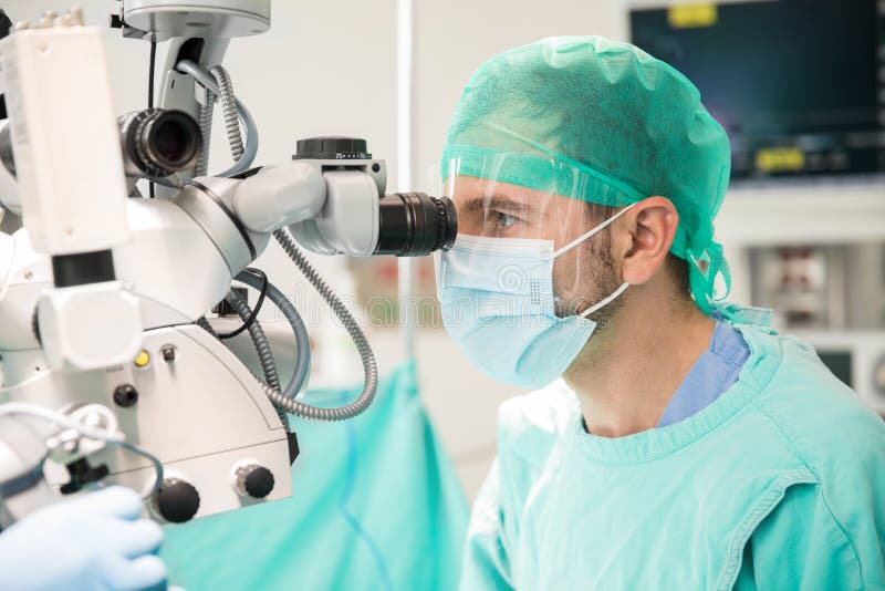 Closeup of a Surgeon Using Microscope Stock Photo - Image of microscope ...