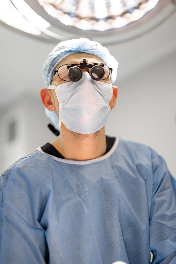 Surgeon with Microscope Glasses during an Operation Stock Image - Image ...