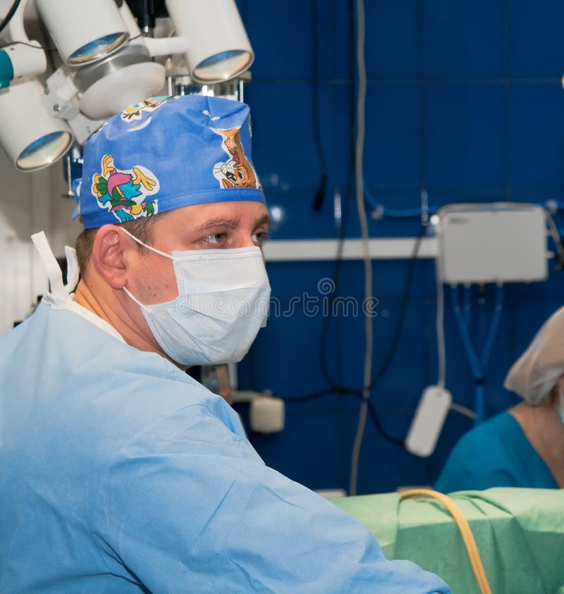 Two surgeons operating stock image. Image of physician - 1143507