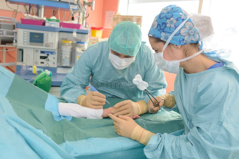 Surgeon Performing Operation on Patients Hand Stock Photo - Image of ...