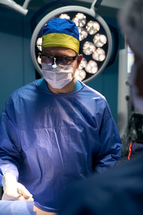 Surgeon Stands in the Operating Room at the Surgical Table Stock Photo ...
