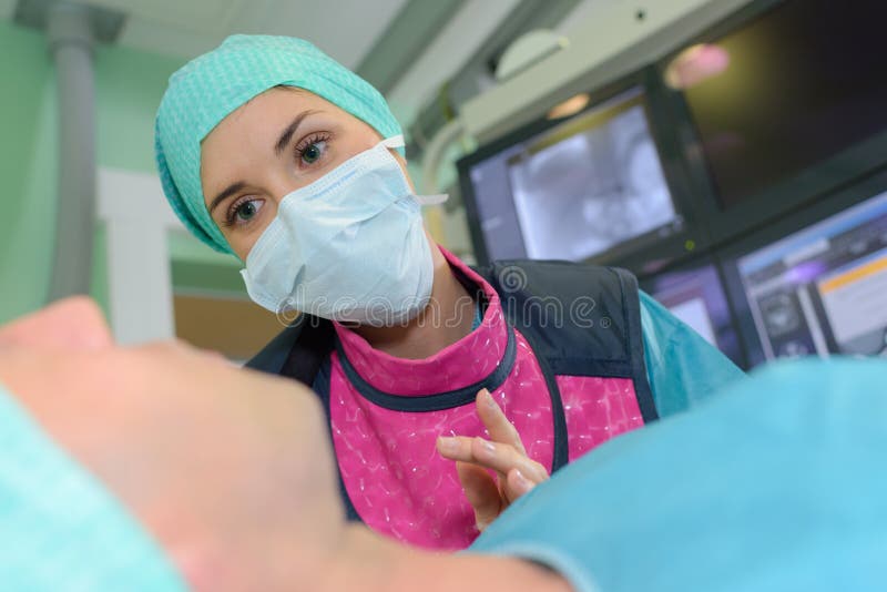 Surgeon talking to patient stock image. Image of talk - 261514553