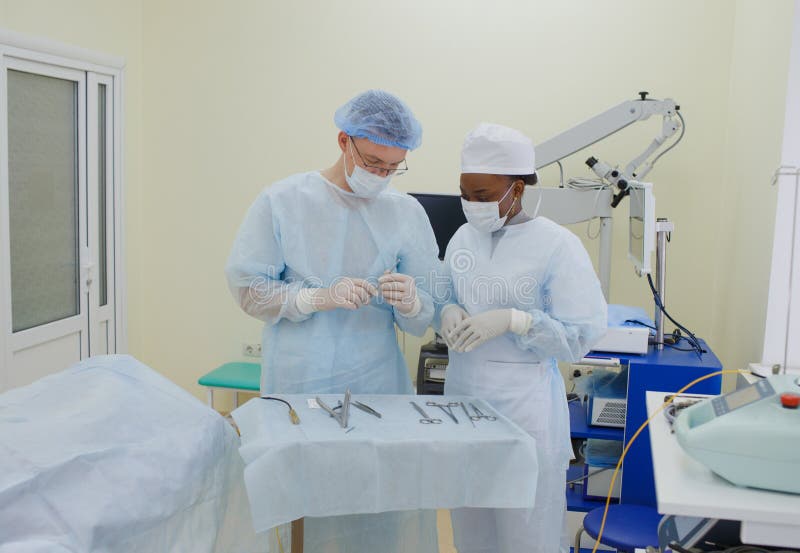 The Surgeon, Together with the Assistant Assistant, Prepare for the ...