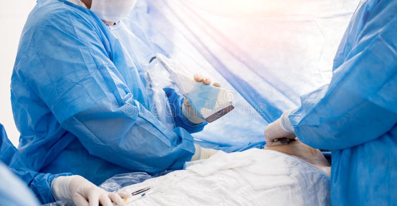 The Surgeon Uses a Portable Fluorescence Imaging Device during Breast ...