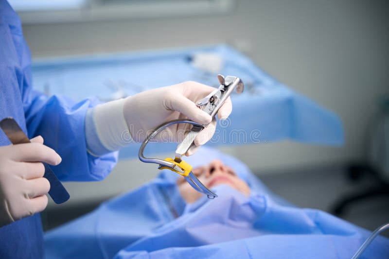 Surgeon Uses a Special Instrument in His Work Stock Image - Image of ...