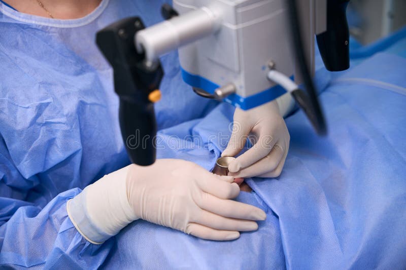 Surgeon Uses Special Optical Equipment, during the Operation Stock ...