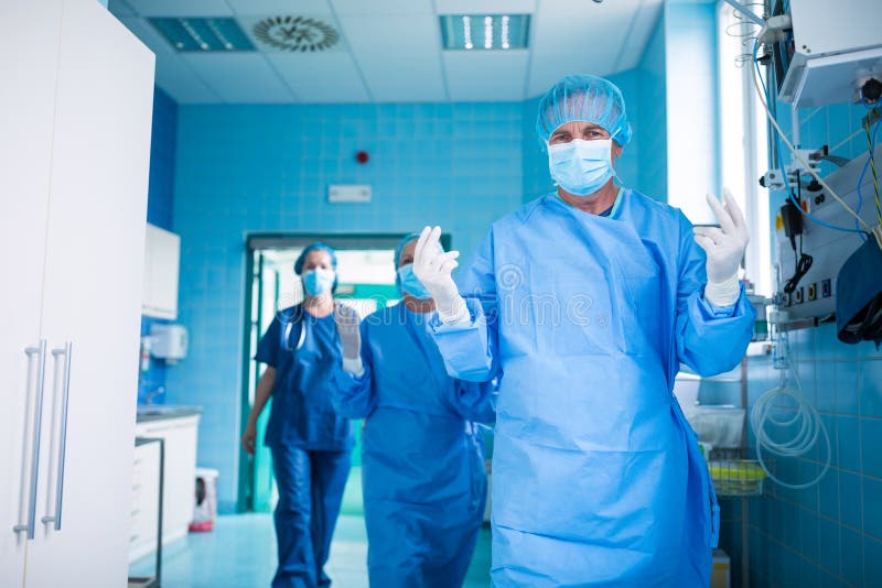 Surgeon Walking in Operation Room Stock Photo - Image of preparing ...