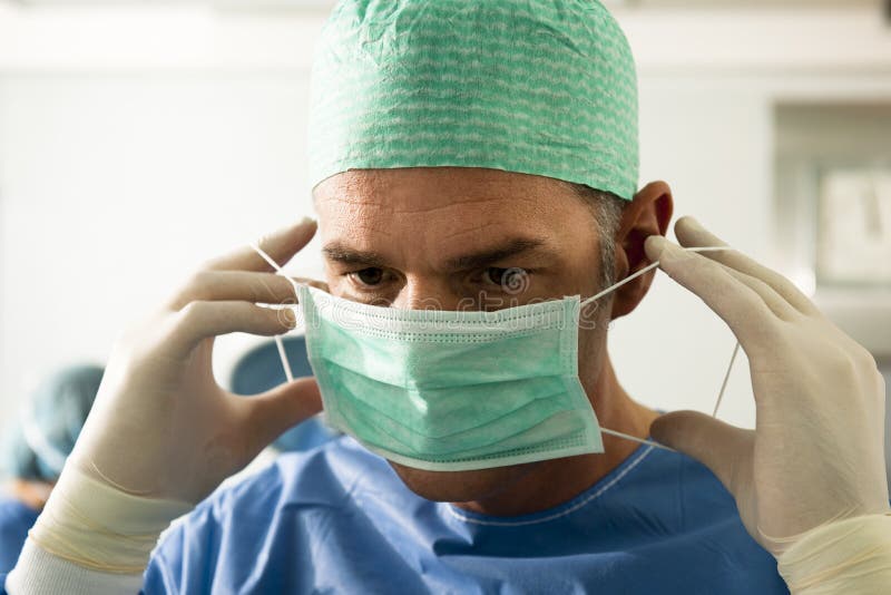 Surgeon Wearing Protective Mask Stock Image - Image of center, mask ...