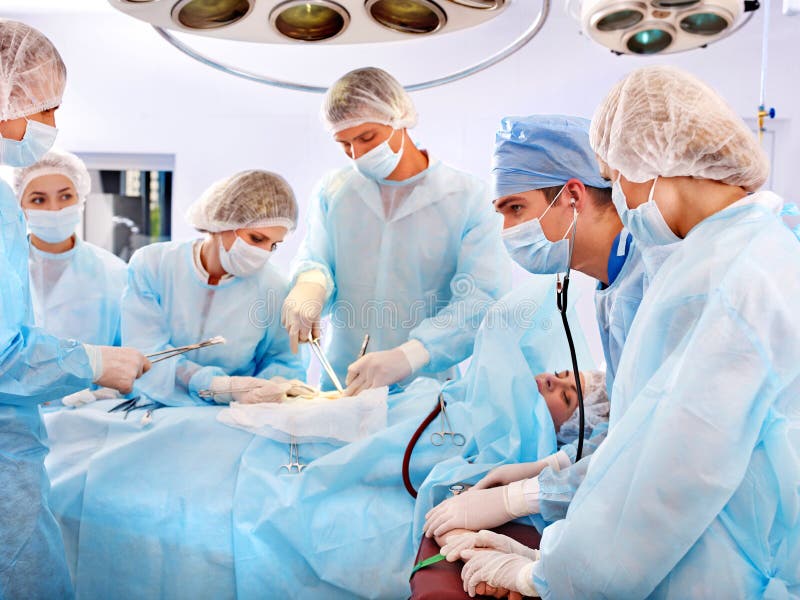 Multi-ethnic Surgeons during a Surgery Stock Image - Image of ailment ...
