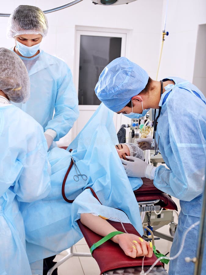 Surgeon at Work in Operating Room Stock Photo - Image of doctor, coat ...