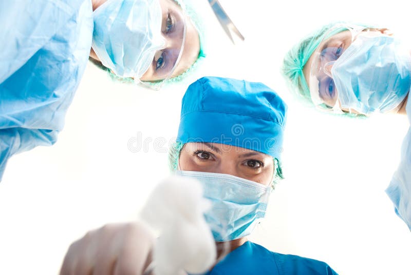 Surgeons above patient stock image. Image of adults, goggles - 16981509