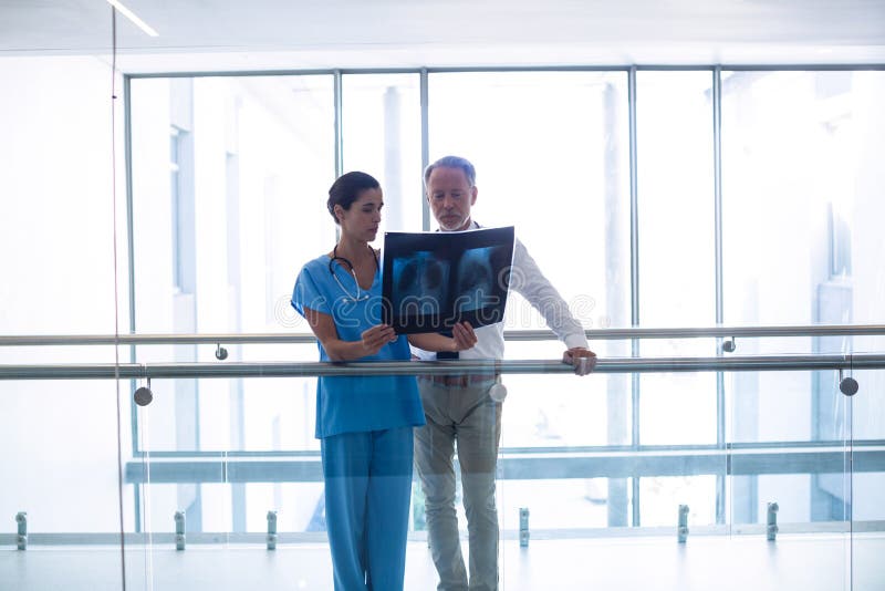 Surgeons Discussing Over X-ray Stock Photo - Image of discussing ...