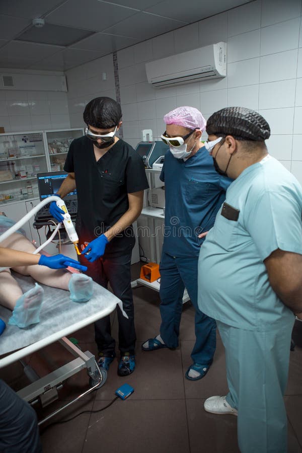 Surgeons Surgeons Doing Leg Surgery Stock Image - Image of catheter ...