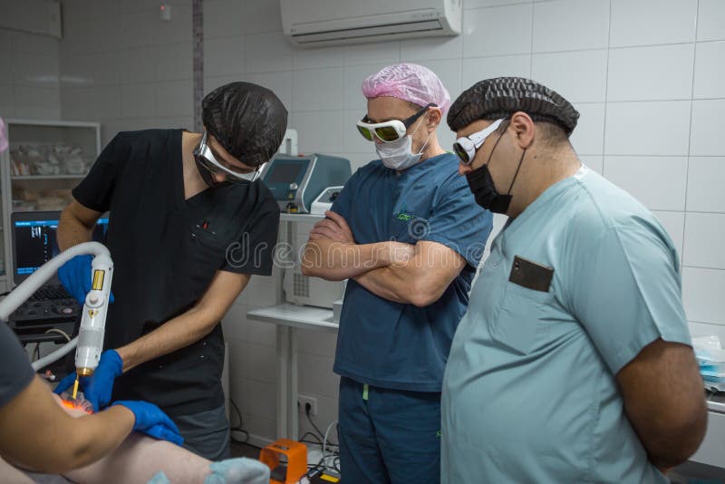 Surgeons Surgeons Doing Leg Surgery Stock Image - Image of catheter ...