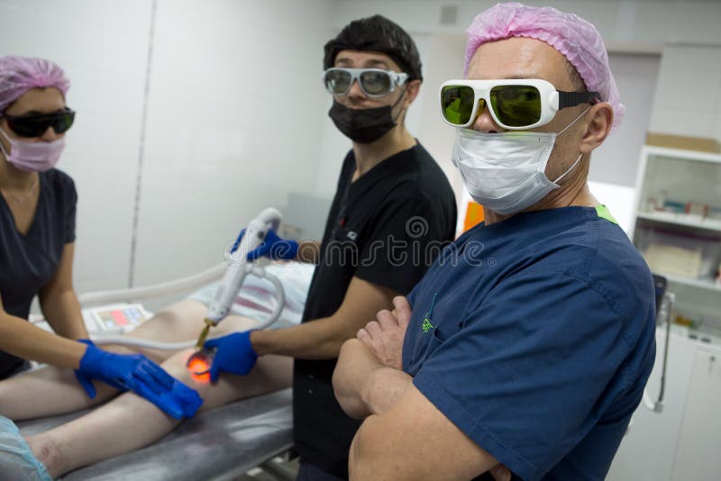 Surgeons Surgeons Doing Leg Surgery Stock Photo - Image of adult ...