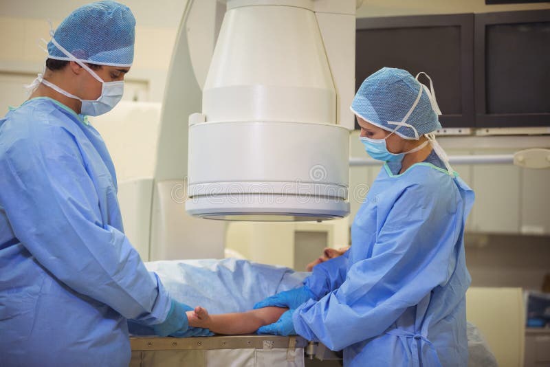 Surgeons Examining Patient in Operation Theater Stock Image - Image of ...