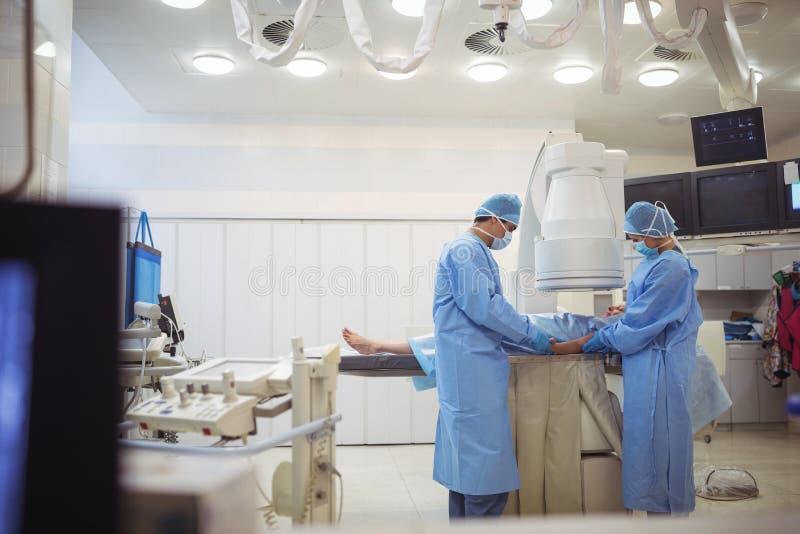 Surgeons Examining Patient in Operation Theater Stock Image - Image of ...