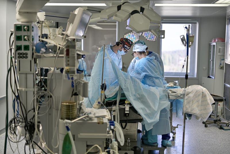 Surgeons in operating room stock photo. Image of illness - 106421540