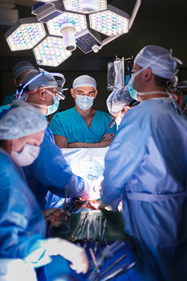 Surgeons in the Operating Room with a Patient Stock Image - Image of ...