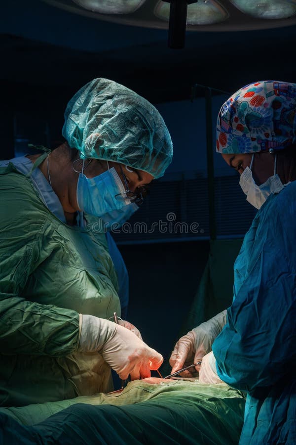 Surgeons in an Operating Room Performing a Procedure. Stock Image ...