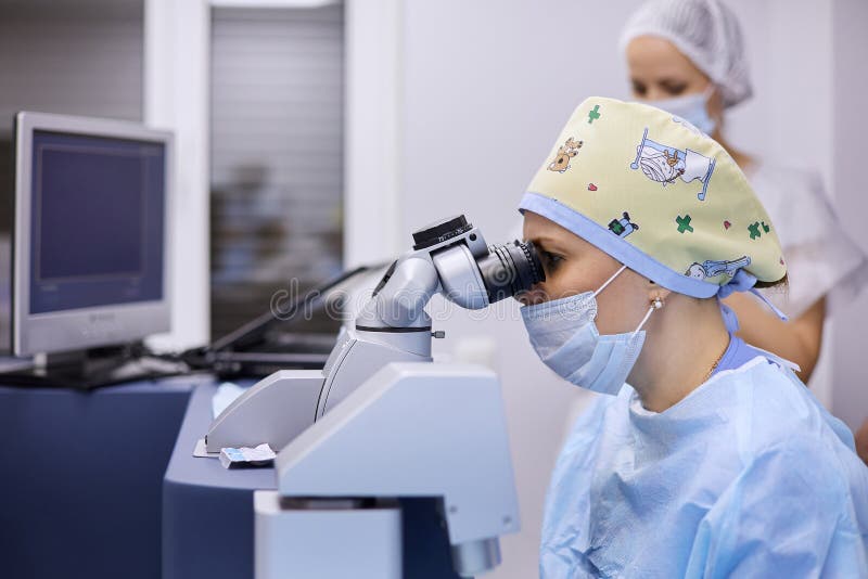 The Surgeon Uses a Microscope during Surgery Stock Image - Image of ...