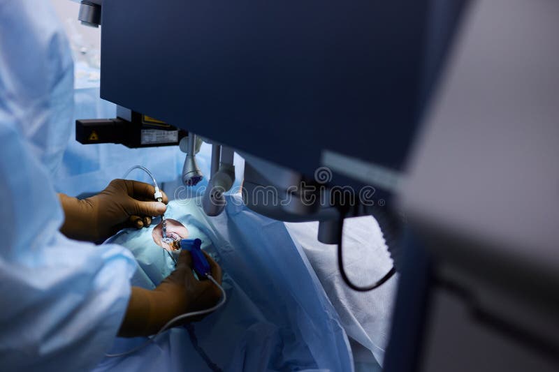 Surgeons Performing Eye Surgery in the Operating Room Stock Photo ...