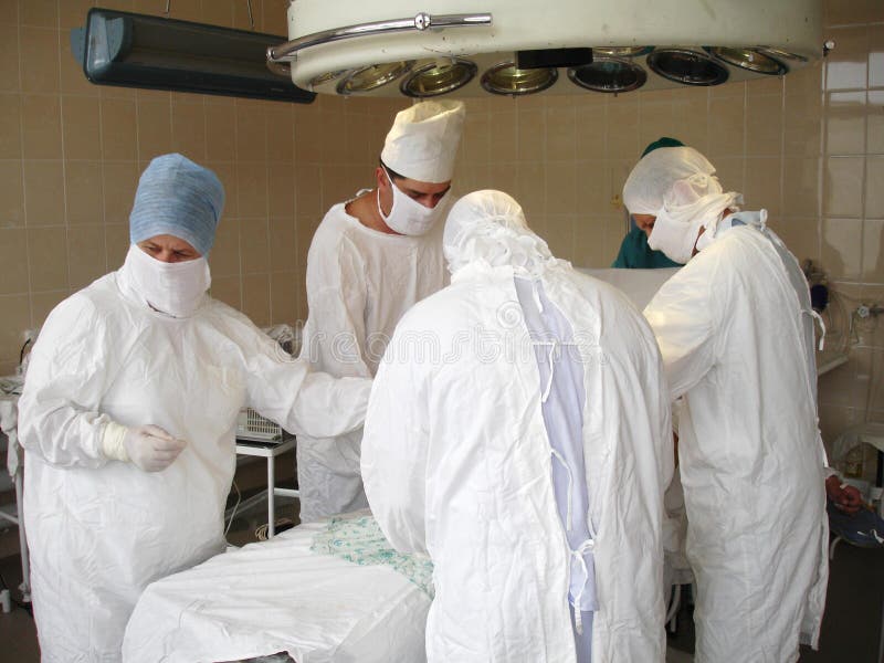 Surgeons Performing Operation. Stock Photo - Image of hospital ...