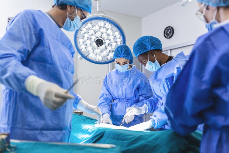 Surgeons Performing Operation in Operation Theater. Breast Augmentation ...