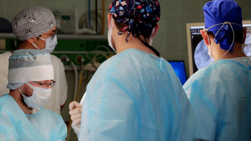 Surgeons Conducting a Surgical Procedure in a Sterile Operating Room ...
