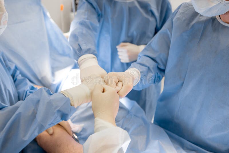 Surgeons Shaking Hands after Successful Operation Stock Photo - Image ...