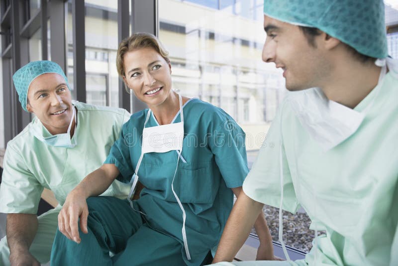Surgeons Talking in Corridor at Break Stock Image - Image of indoors ...
