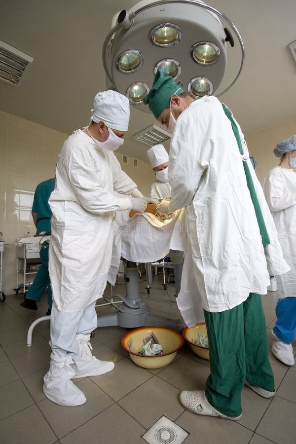 Surgeons team at work stock image. Image of hospital - 11873609