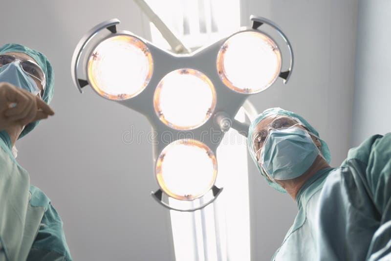 Surgeons Under Surgery Lights in Operating Theatre Stock Image - Image ...