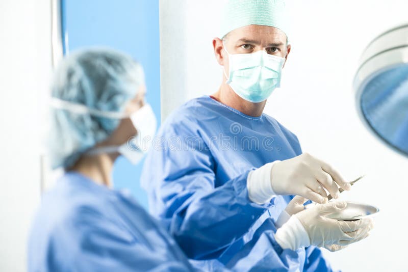 Surgical Team Working in Operating Theatre Stock Photo - Image of ...
