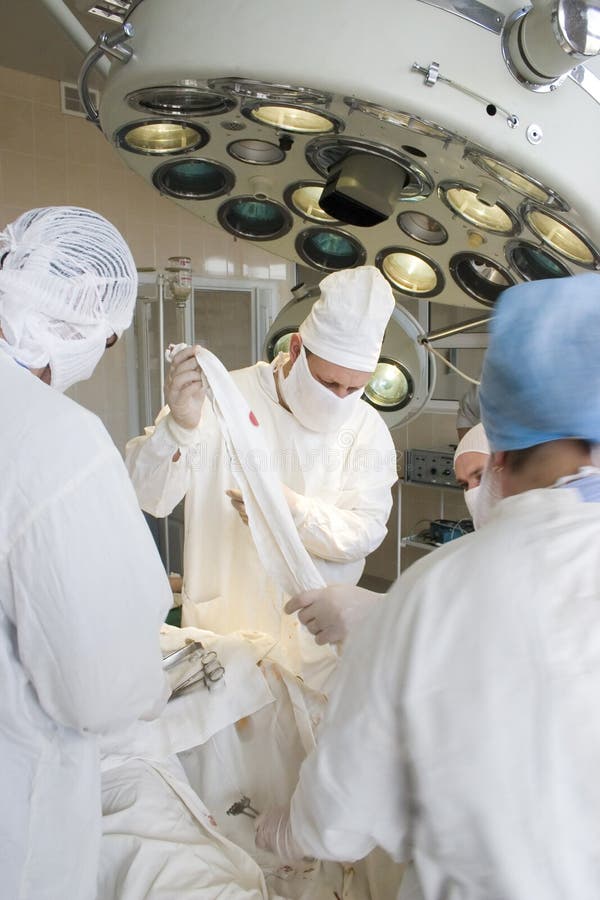 Surgeons at work stock photo. Image of gloves, clinic - 4591154
