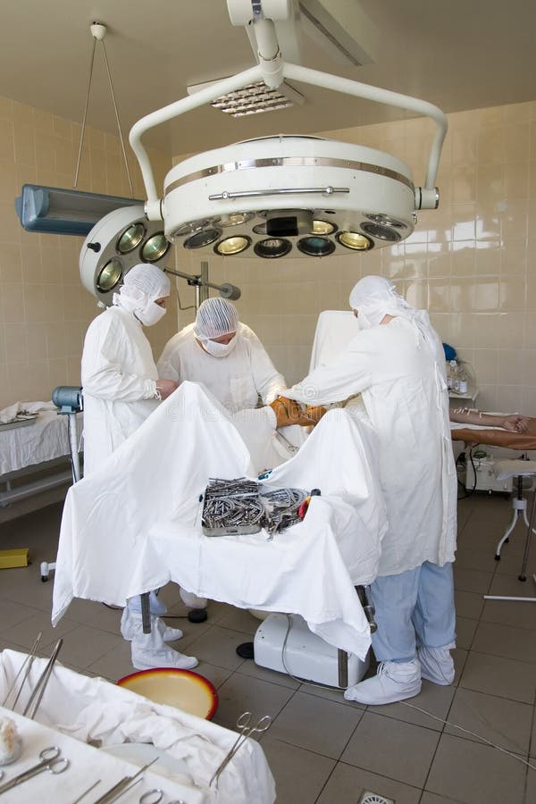 Surgeons at work stock image. Image of body, correction - 4591155