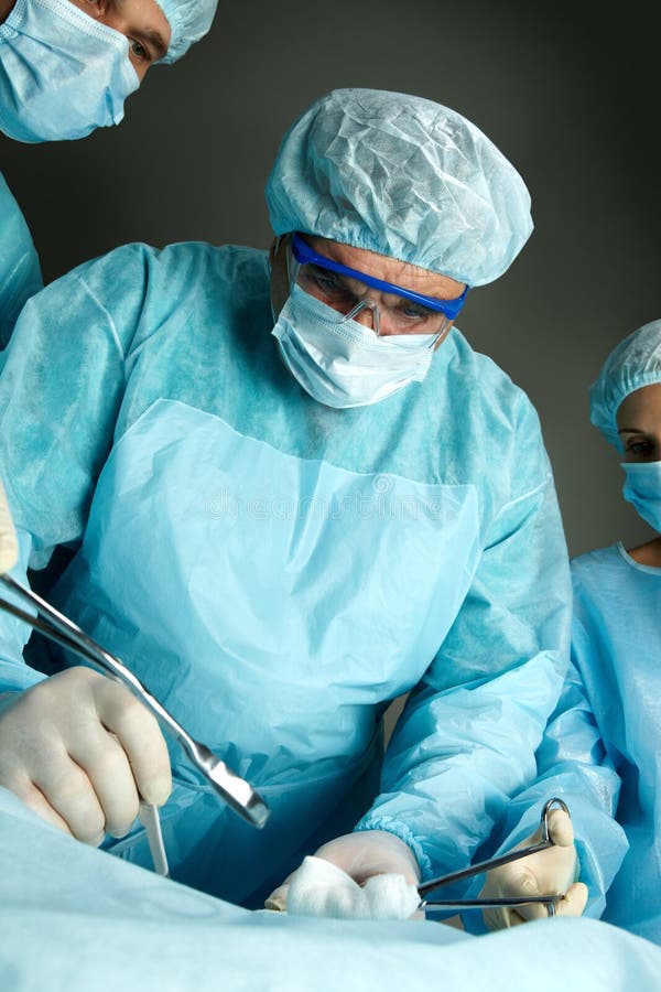 Surgeons at work stock photo. Image of assistant, clinic - 15104424